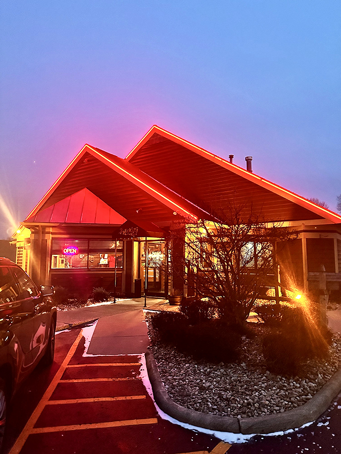 As dusk falls, the restaurant's red-tinged glow calls to hungry travelers like a carnivorous North Star guiding meat lovers home.