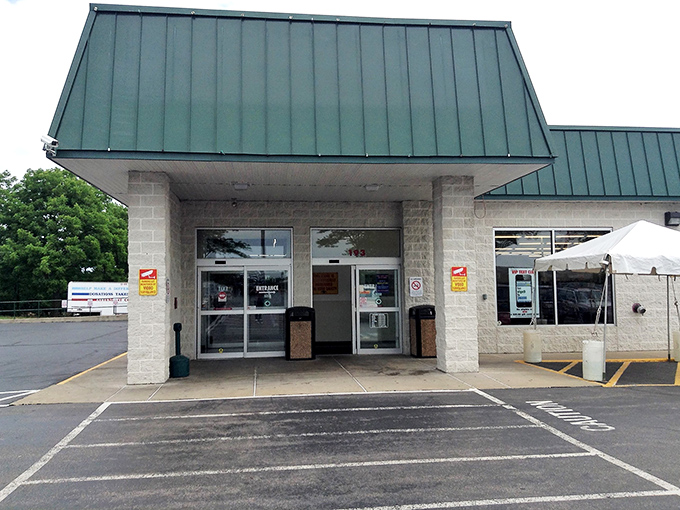 The unassuming entrance to bargain paradise &ndash; where the real magic happens behind those modest doors and under the green-trimmed roof.