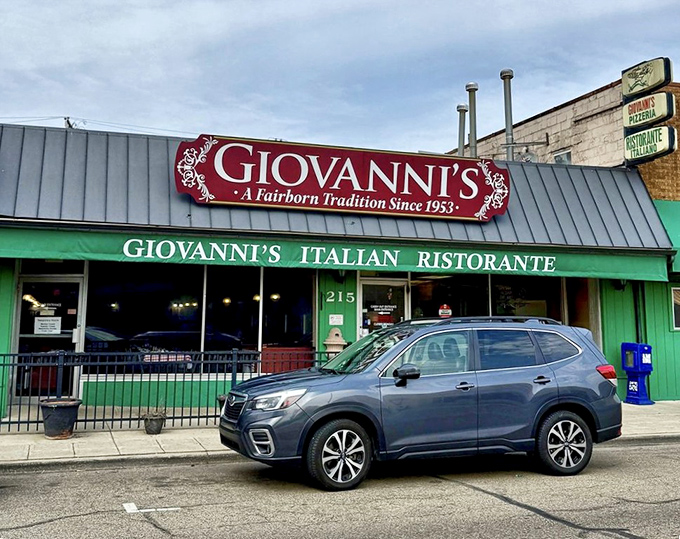 The storefront stands proudly on Main Street, its metal roof and green trim a beacon for those seeking authentic Italian-American cuisine in Fairborn.