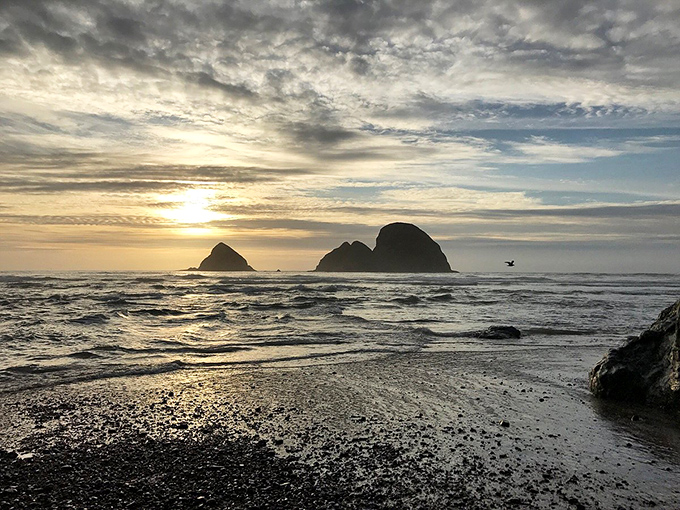 The sun bidding farewell to Three Arch Rocks. This daily light show never gets old&mdash;nature's version of must-see TV.