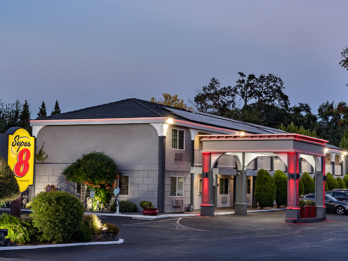 The Super 8's distinctive red and yellow signage glows at dusk, offering weary travelers a comfortable place to rest before continuing their Mendocino County adventures.