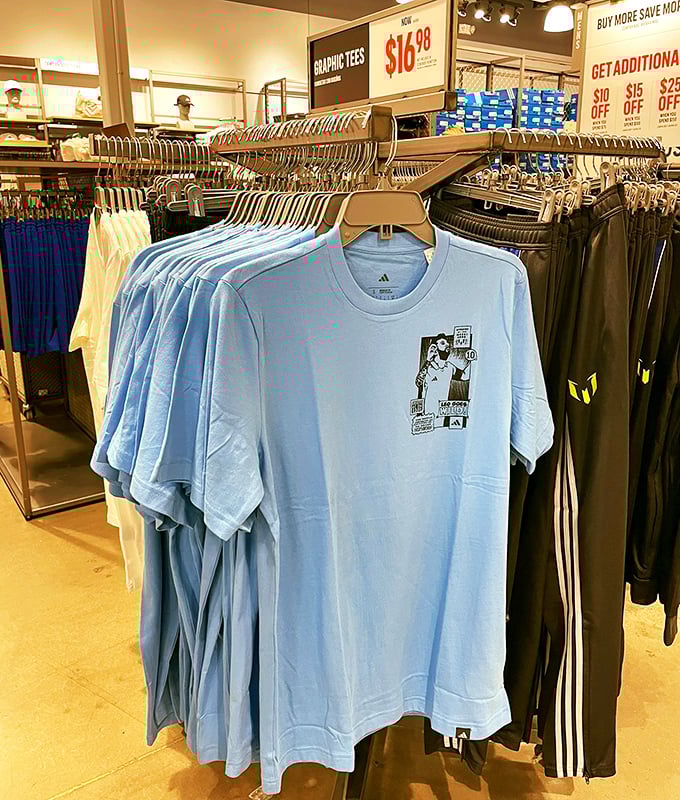 Graphic tees hanging like modern art installations, each one offering the chance to make a statement without actually having to speak.