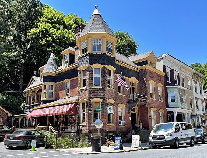 The Dolon House stands on the corner like a Victorian confection with its turrets and detailed brickwork. Architectural gingerbread that actually houses guests instead of fictional witches.