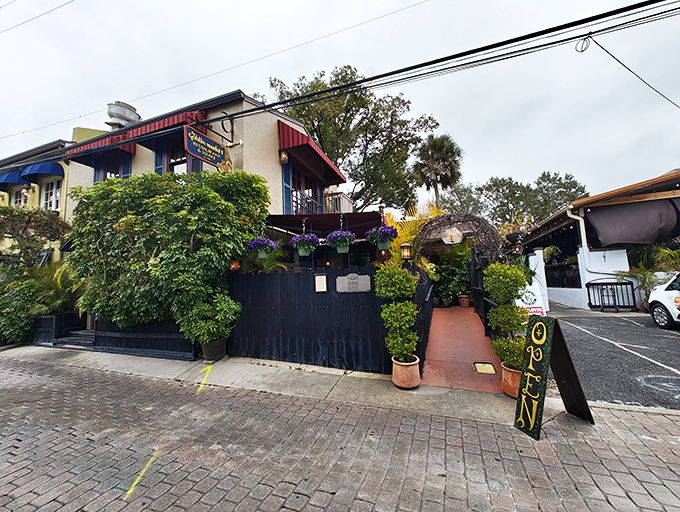 The Goblin Market's lush, plant-draped exterior hints at the literary-inspired culinary adventure waiting inside this local favorite.