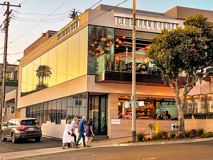 The Strand House commands its corner with contemporary confidence, promising sunset views that pair perfectly with whatever's on your plate.