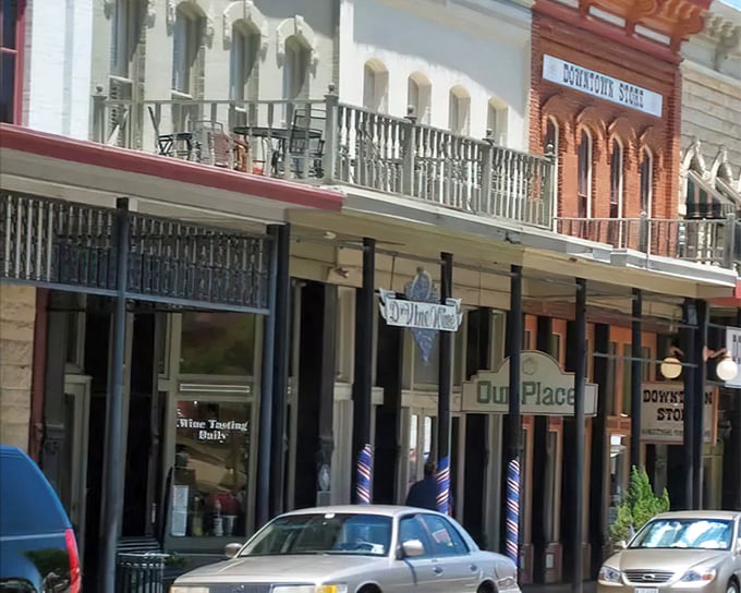 Historic balconies overlook Granbury's main street, where modern businesses thrive in buildings that have witnessed more than a century of Texas history.