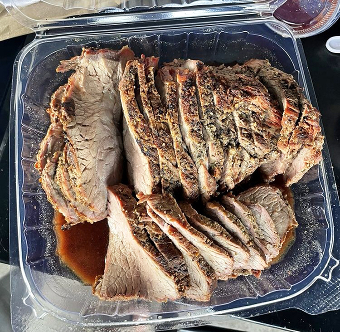 Tri-tip sliced like playing cards from heaven. The smoke ring is so perfect it could make a pitmaster weep.