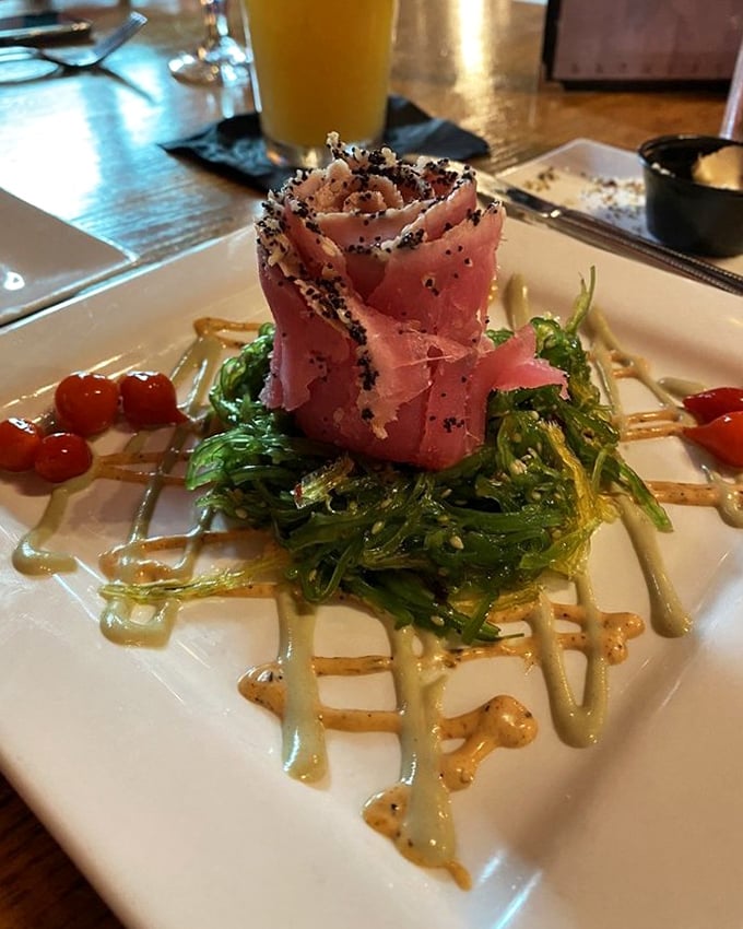 This tuna appetizer isn't just a starter—it's architectural food art with seaweed foundations and sauce drizzles that would make Jackson Pollock proud.
