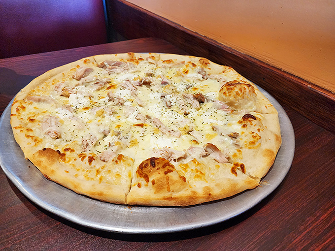 White pizza perfection&mdash;where creamy cheese meets savory toppings in a beautiful relationship that needs no red sauce third wheel.