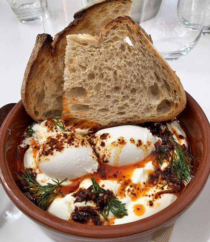 Turkish eggs that would make Istanbul proud. Poached to perfection, nestled in yogurt, with bread ready to soak up every last bit of deliciousness.