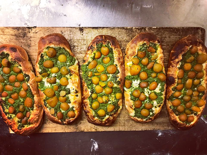 These olive-studded flatbreads look like edible art &ndash; the kind of food that makes you pause to take a picture before inevitably devouring it.