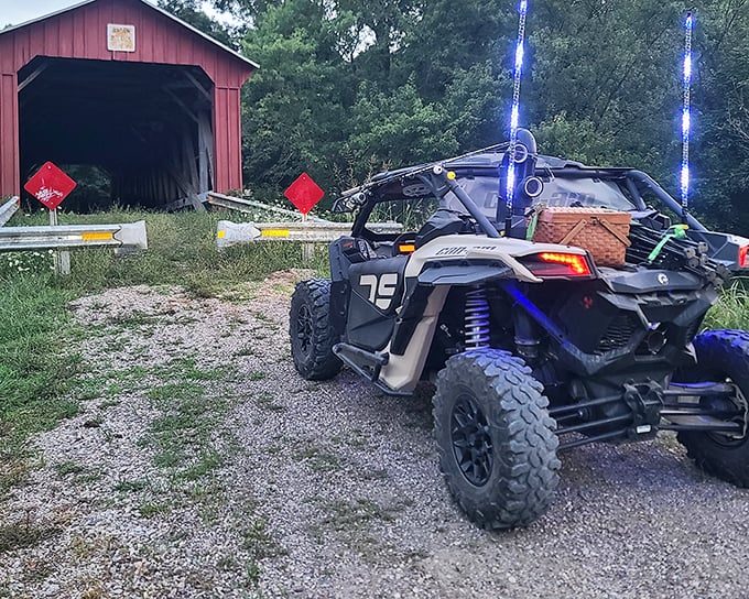 Modern adventures meet historical pathways as recreational vehicles pause to appreciate engineering from a less hurried era.