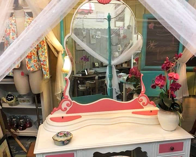 A vanity fit for a 1950s starlet, complete with scalloped mirror and pink accents. Morning routines were an event, not just a rushed ritual.