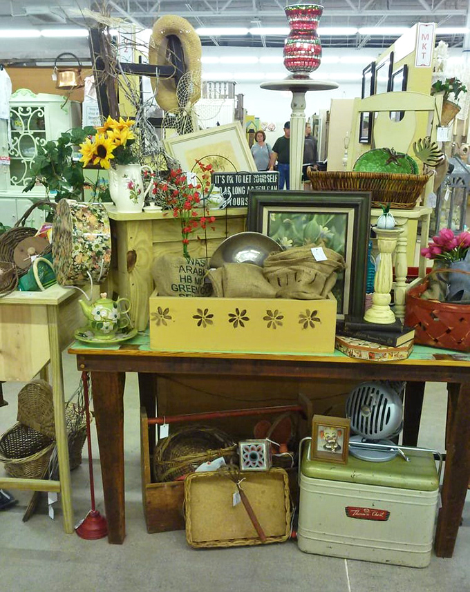 Vintage treasures artfully arranged create vignettes of nostalgia. That yellow wooden box? Probably held someone's most precious keepsakes once upon a time.