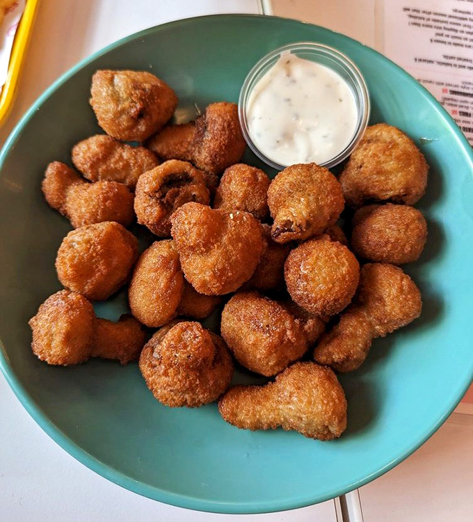 These golden-fried mushroom bites prove that vegetarian options don't have to be the consolation prize on a comfort food menu.