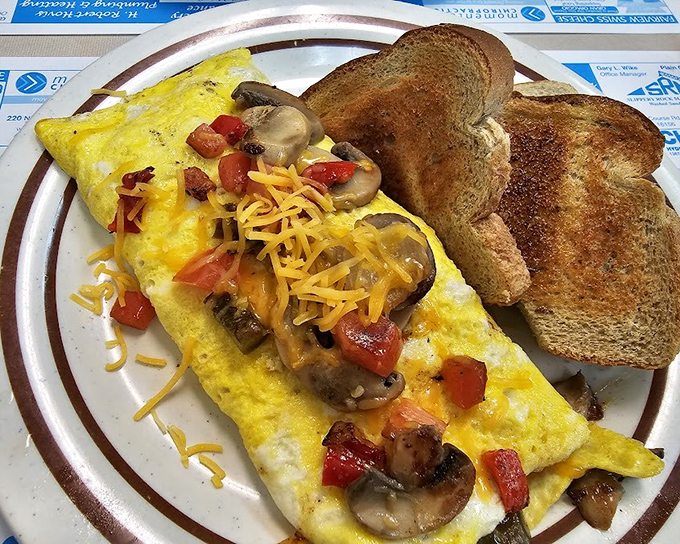 A veggie omelet that doesn't preach about health benefits - it just delivers honest flavor. Those mushrooms and peppers found their true calling.