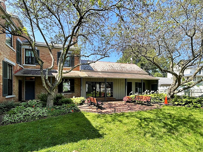 The side garden view showcases the peaceful grounds where Victorian residents might escape household bustle without actually having to interact with the public.