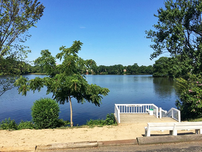 Beyond the restaurant, a serene waterfront view offers diners a peaceful moment of Delaware natural beauty after their meal.