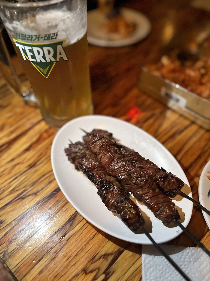 These beef skewers aren't just cooked &ndash; they're transformed. The char marks are like flavor autographs from the grill master.