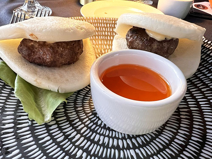 Bao buns cradle perfectly seasoned beef sliders&mdash;a delicious East-meets-West moment that proves The Belvedere isn't afraid to color outside culinary lines.