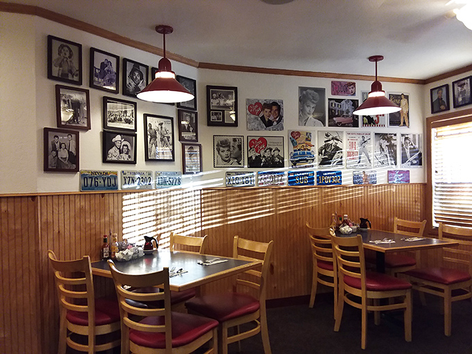 The wall of memories features license plates, vintage photos, and memorabilia that create a museum of everyday Americana. History you can eat with.