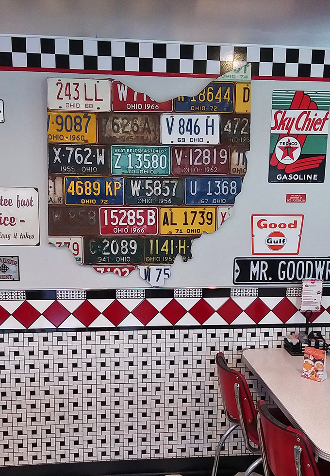Ohio pride displayed through vintage license plates arranged in state formation. Nostalgia isn't just served on plates&mdash;it covers the walls too.