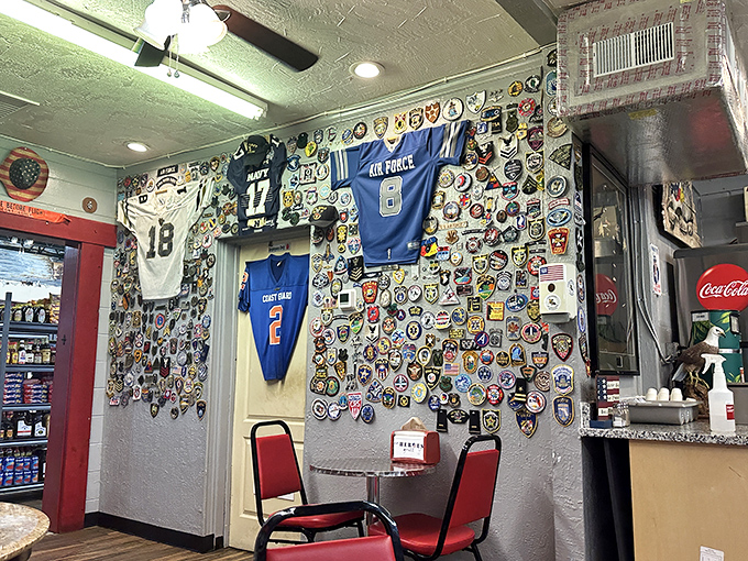 The wall of patches, jerseys, and memorabilia tells stories of service and community that are as rich as the menu offerings.