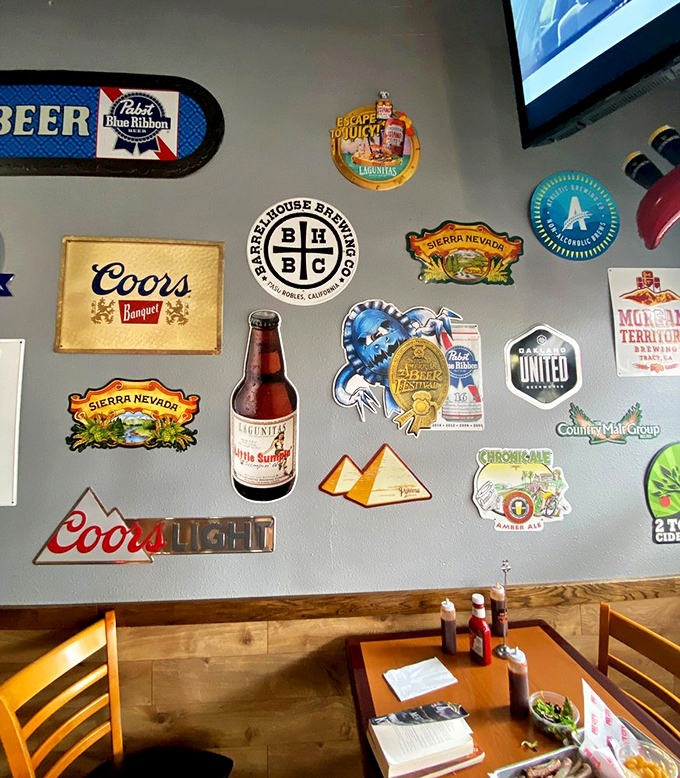 Beer memorabilia that tells stories of brews gone by. This wall of nostalgia pairs perfectly with the timeless tradition of barbecue.