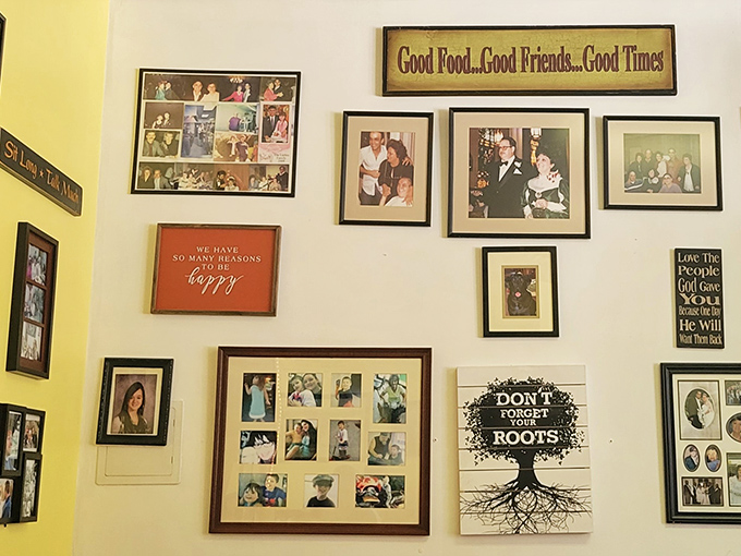 Family photos and inspirational quotes create a living scrapbook on sunny yellow walls. "Good Food...Good Friends...Good Times" isn't just decor&mdash;it's a promise.