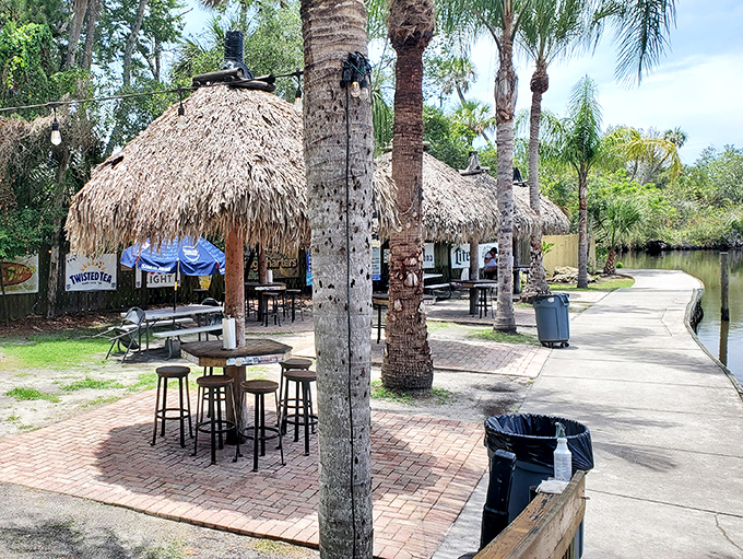 Palm trees and thatched huts line the waterway, creating a Florida postcard scene that no filter could improve upon.
