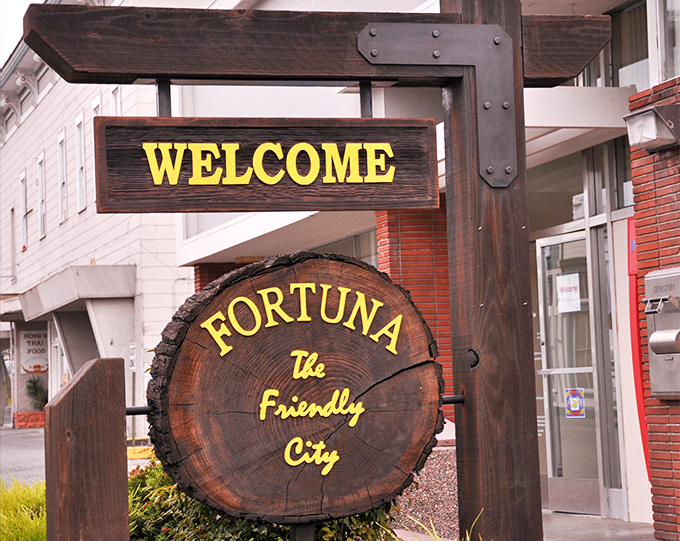 Fortuna's welcome sign, carved from a redwood slice, perfectly captures the town's identity: natural, unpretentious, and literally rooted in its surroundings.