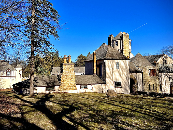 Winter sunlight casts long shadows across Stronghold's grounds, highlighting the castle's distinctive towers against the clear blue Illinois sky.
