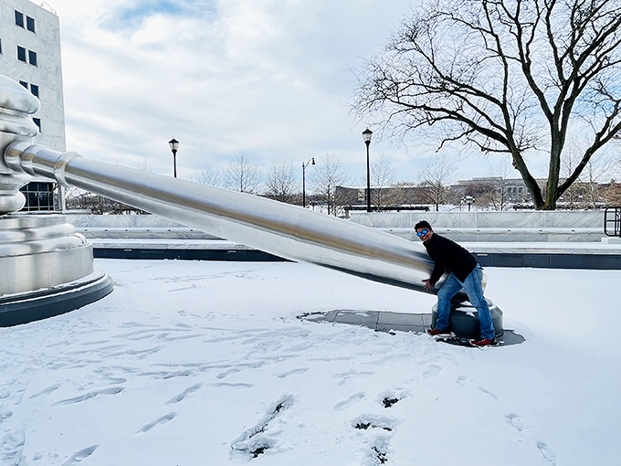 Winter brings a whole new dimension to the gavel experience, with snow creating a pristine canvas for this massive metal masterpiece.