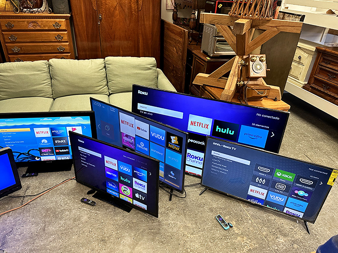 The TV testing area showcases screens of all sizes, proving that yesterday's technology still delivers today's entertainment at tomorrow's prices.