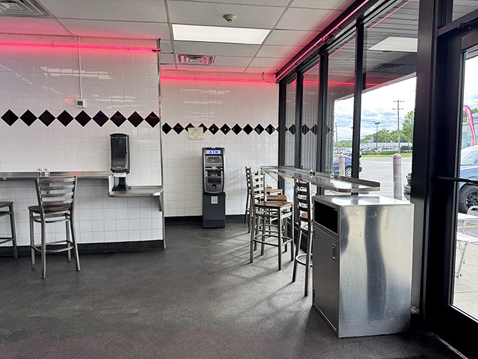 The stark interior with its red neon accents&mdash;a temple of simplicity where the focus remains squarely on the food.