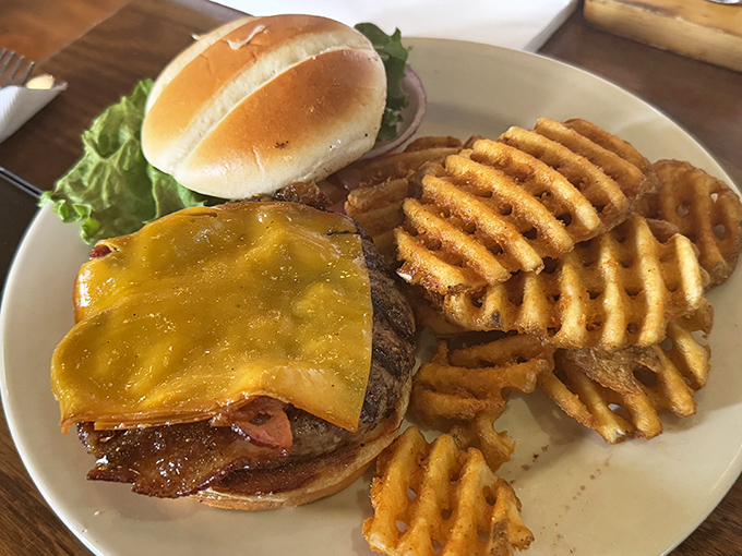 A burger that doesn't just satisfy hunger&mdash;it obliterates it. Those waffle fries aren't sidekicks; they're co-conspirators in deliciousness.