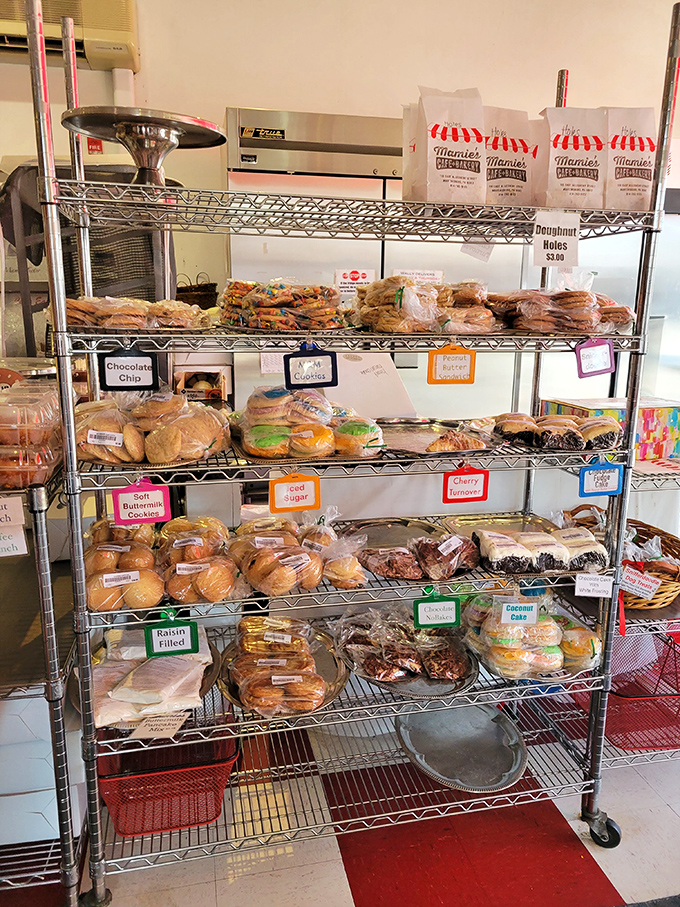 A bakery rack that's basically a treasure chest for carb enthusiasts. Each shelf offers a different path to happiness, all wrapped in plastic.