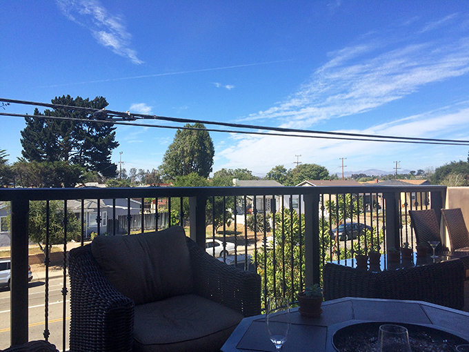 A breath of fresh air after a hearty meal. This outdoor seating area offers the perfect vantage point for digesting both dinner and small-town charm.