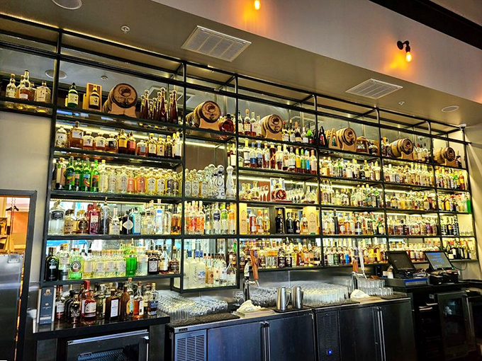 Floor-to-ceiling spirits collection that would make any home bartender weep with envy - liquid artistry meets steakhouse sophistication.