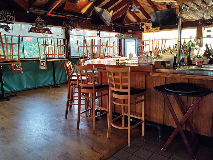 The tiki bar interior where bamboo and beer create an atmosphere that whispers "vacation" in every corner.