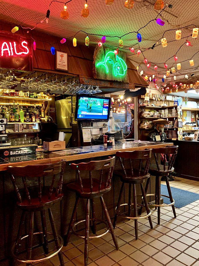 The bar area glows with neon and possibility, where fishing tales grow taller with each round and nobody seems to mind.