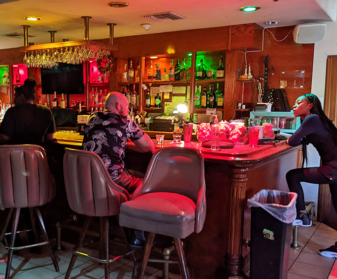 The bar area glows with promise, where strangers become friends and friends become family over shared plates and stories.