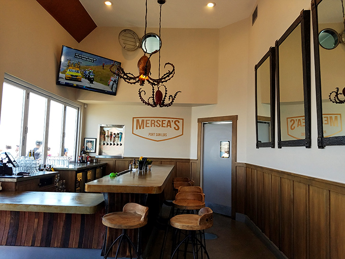 The bar area whispers "maritime charm" without shouting "tacky nautical theme park"&mdash;just the right balance of wood, warmth, and octopus lighting.