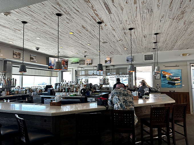 The bar's whitewashed ceiling and pendant lights create the perfect backdrop for that moment when you decide "just one more" is absolutely necessary.