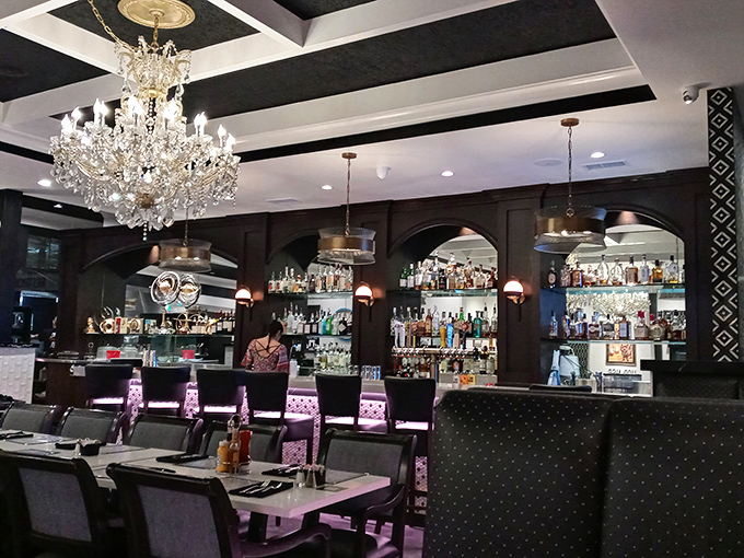 The classic diner counter where conversations flow as smoothly as the freshly brewed coffee.