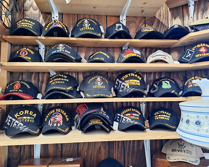 Military history displayed with respect &ndash; rows of veteran caps tell stories of service, sacrifice, and the people who wore them.