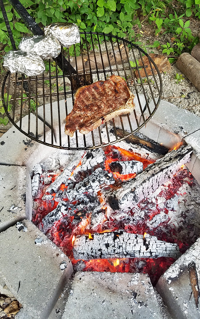 Outdoor cooking elevated to an art form. That sizzling steak proves everything tastes better when cooked over an open flame.