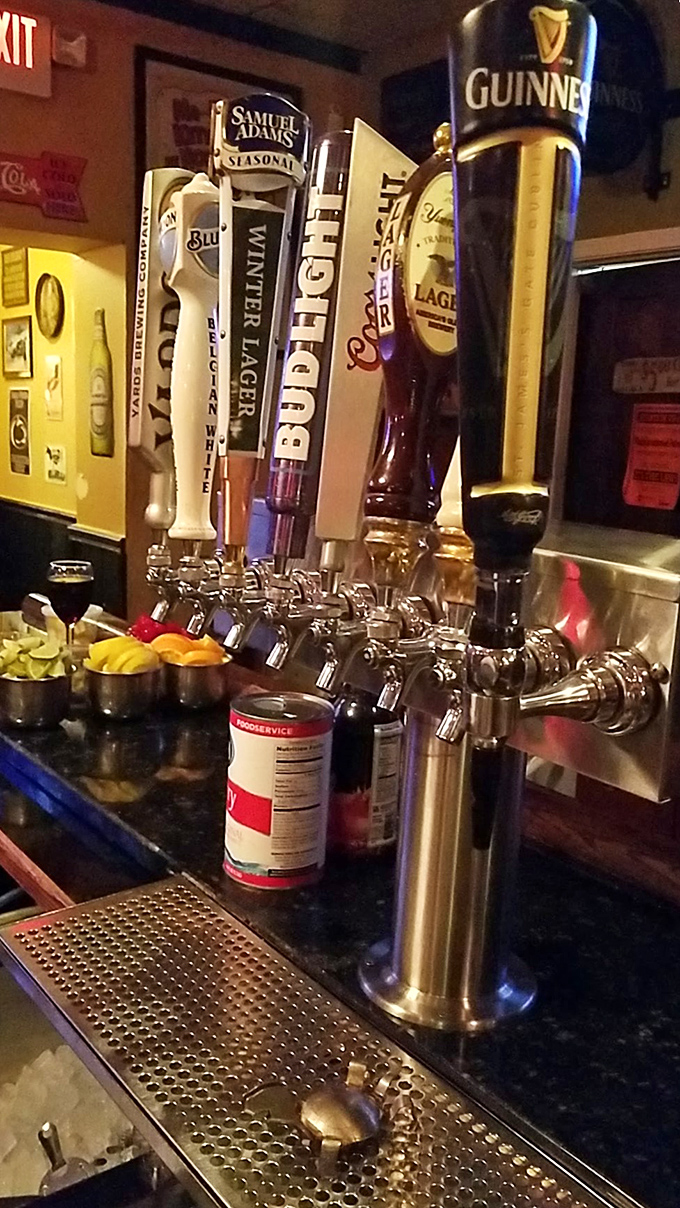 A lineup of taps standing at attention, ready to serve. Guinness takes the position of honor, as is proper in any establishment with Irish roots.