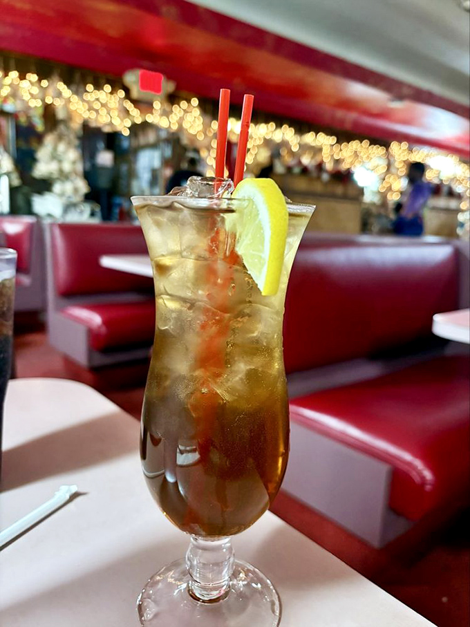 A cocktail that says, "Yes, I'm at a pizza joint, but I still have standards." The red booths in the background have witnessed countless first dates.