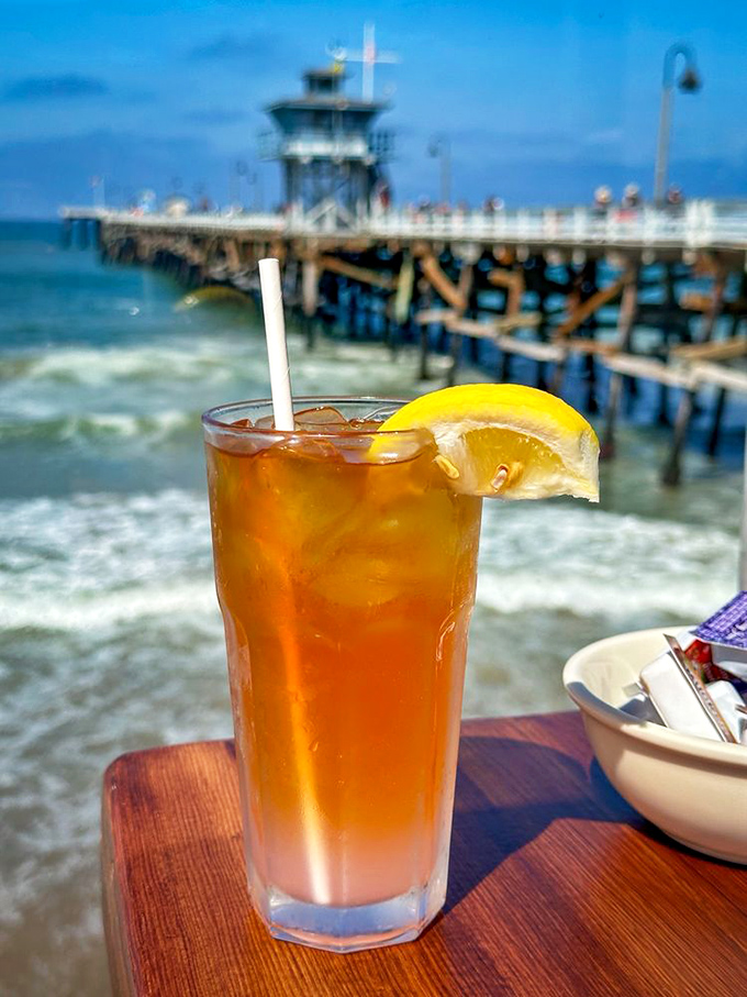 An iced tea with the San Clemente Pier as its backdrop—proving some drinks deserve better scenery than others. Ocean views improve flavor by 37%.